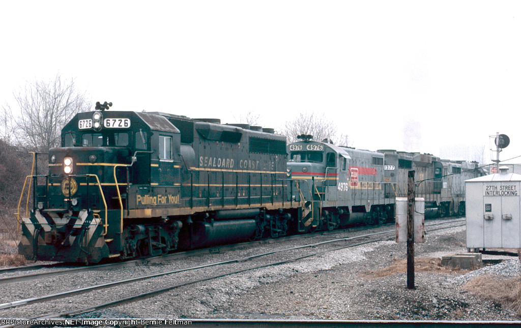 Seaboard System GP40 #6726, GP16 #4976 and GP30's 1377 and 1397 lead an intermodal train at 27th ...